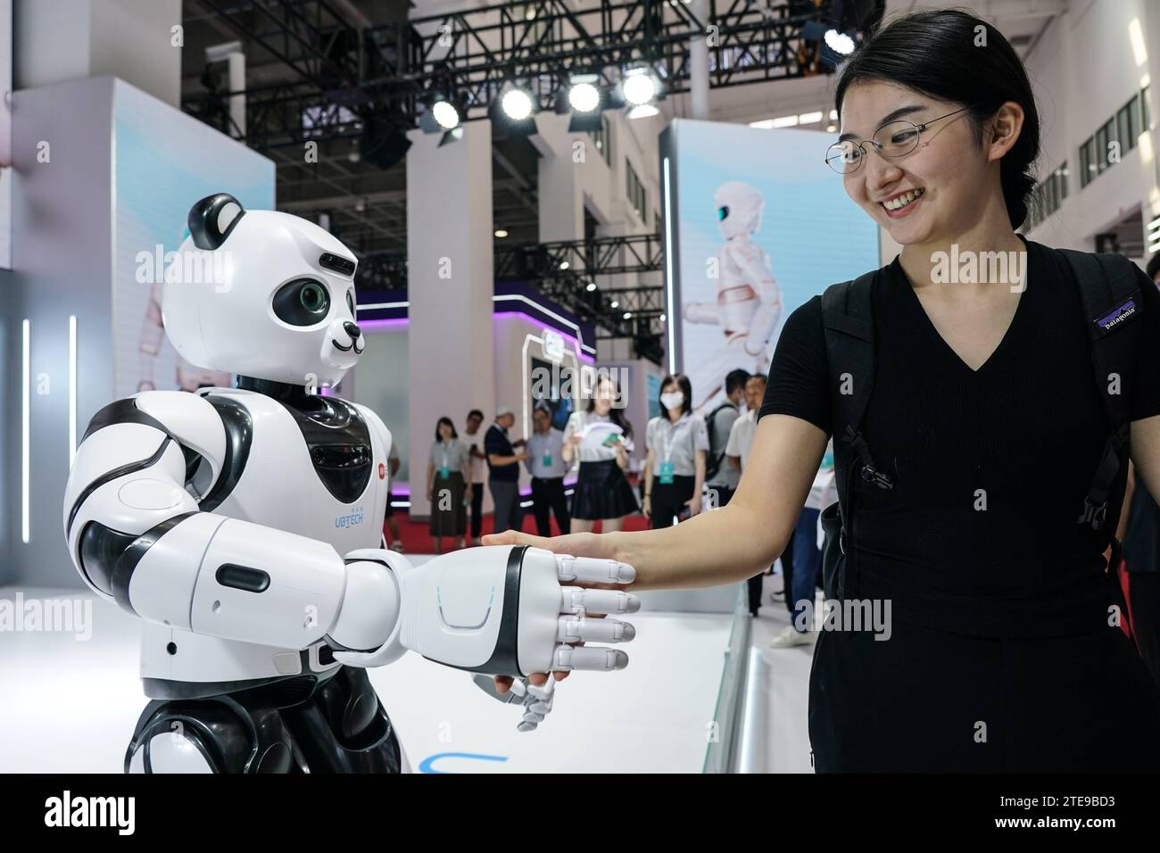 Beijing, China. 16th Aug, 2023. A visitor interacts with an intelligent ...