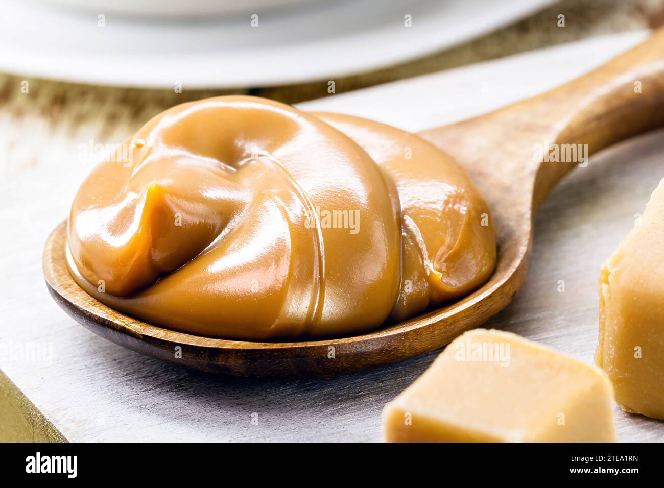 spoon of dulce de leche or homemade vegan pasty milk candy, caramel ...