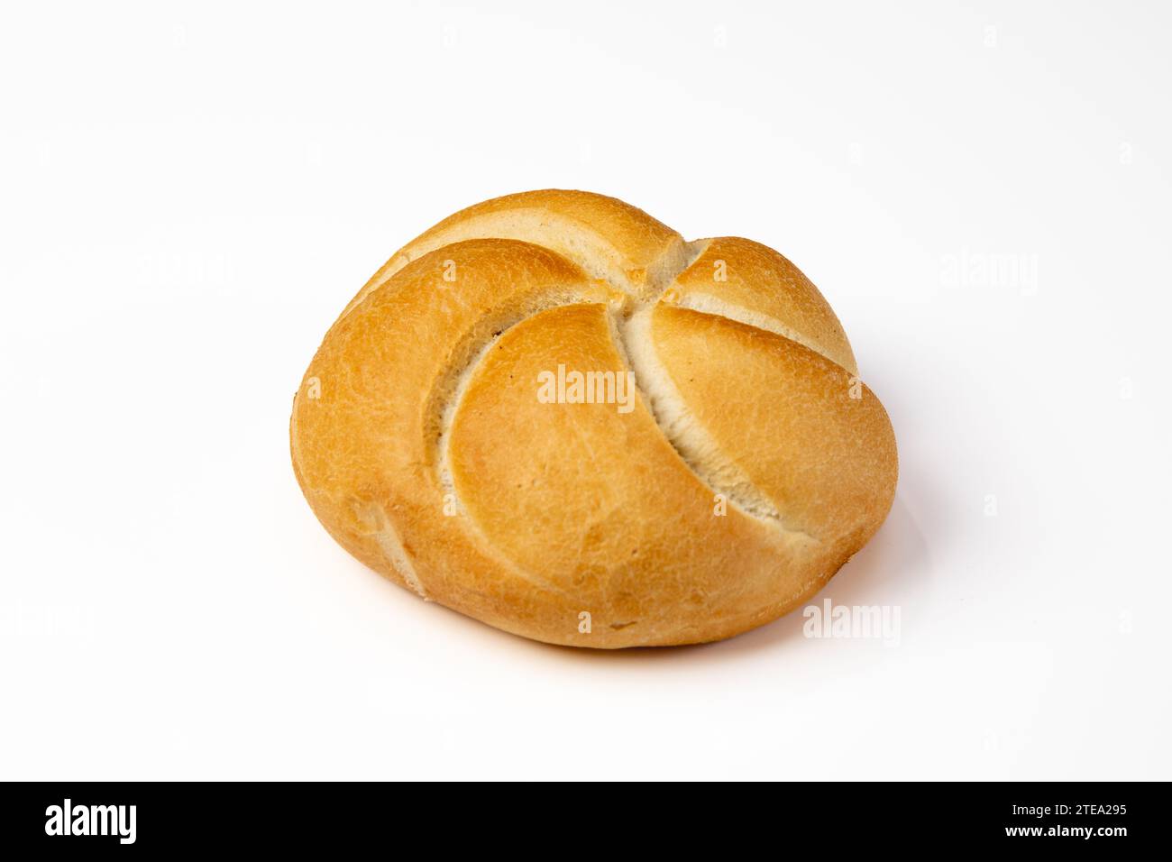 Side view of Kaiser roll on white table Stock Photo - Alamy