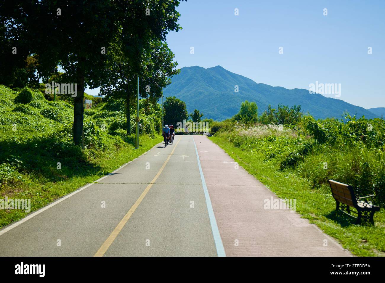 Namyangju City, South Korea - September 30, 2023: Distant cyclists ...