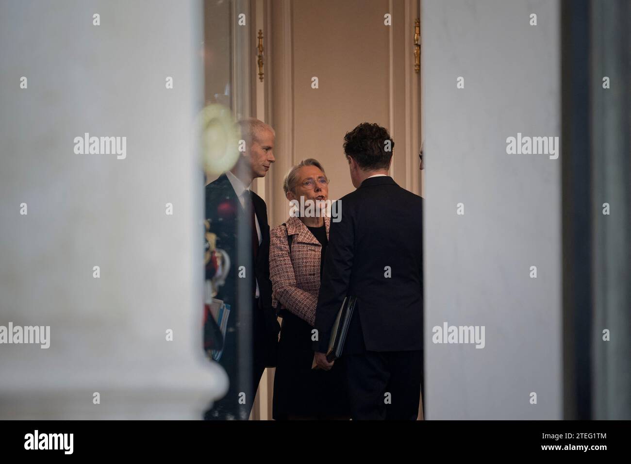 Paris, France. 20th Dec, 2023. Prime Minister Elisabeth Borne, flanked ...