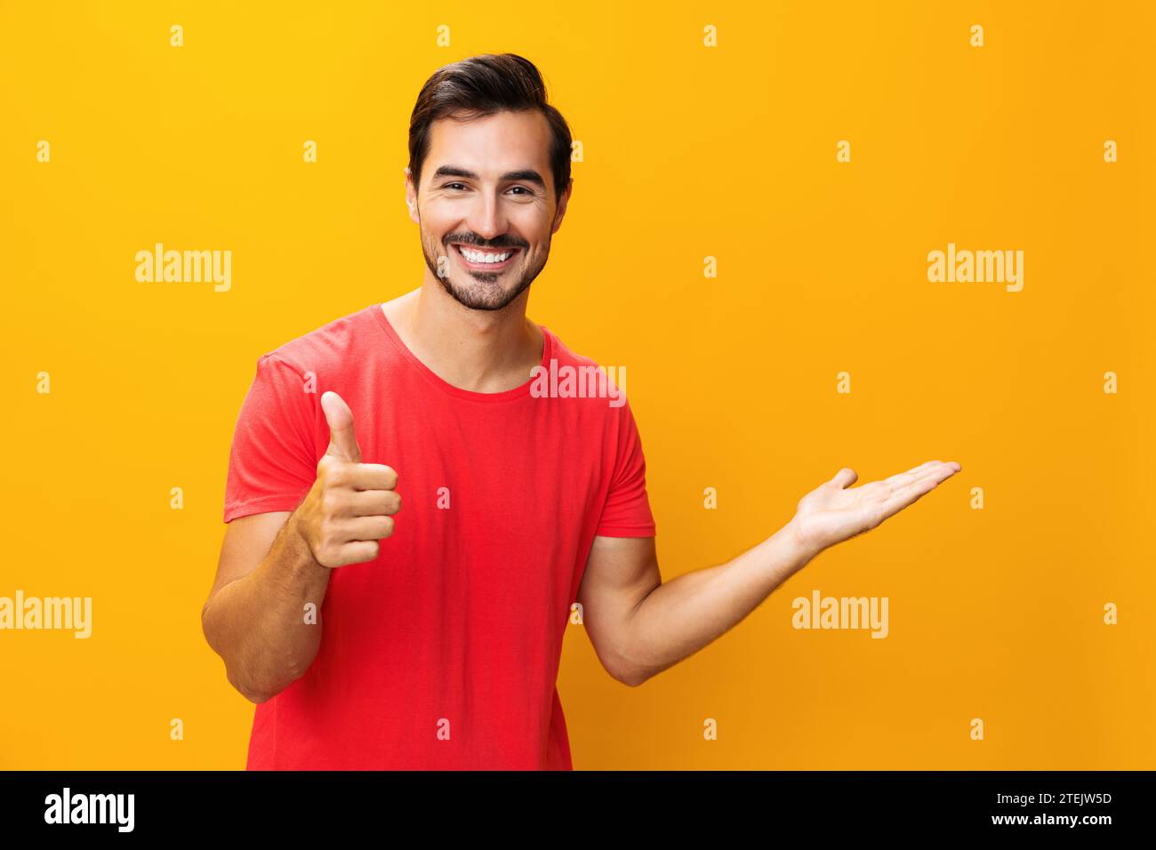 Man yellow arm studio trendy space copy style laughing smiling fashion ...