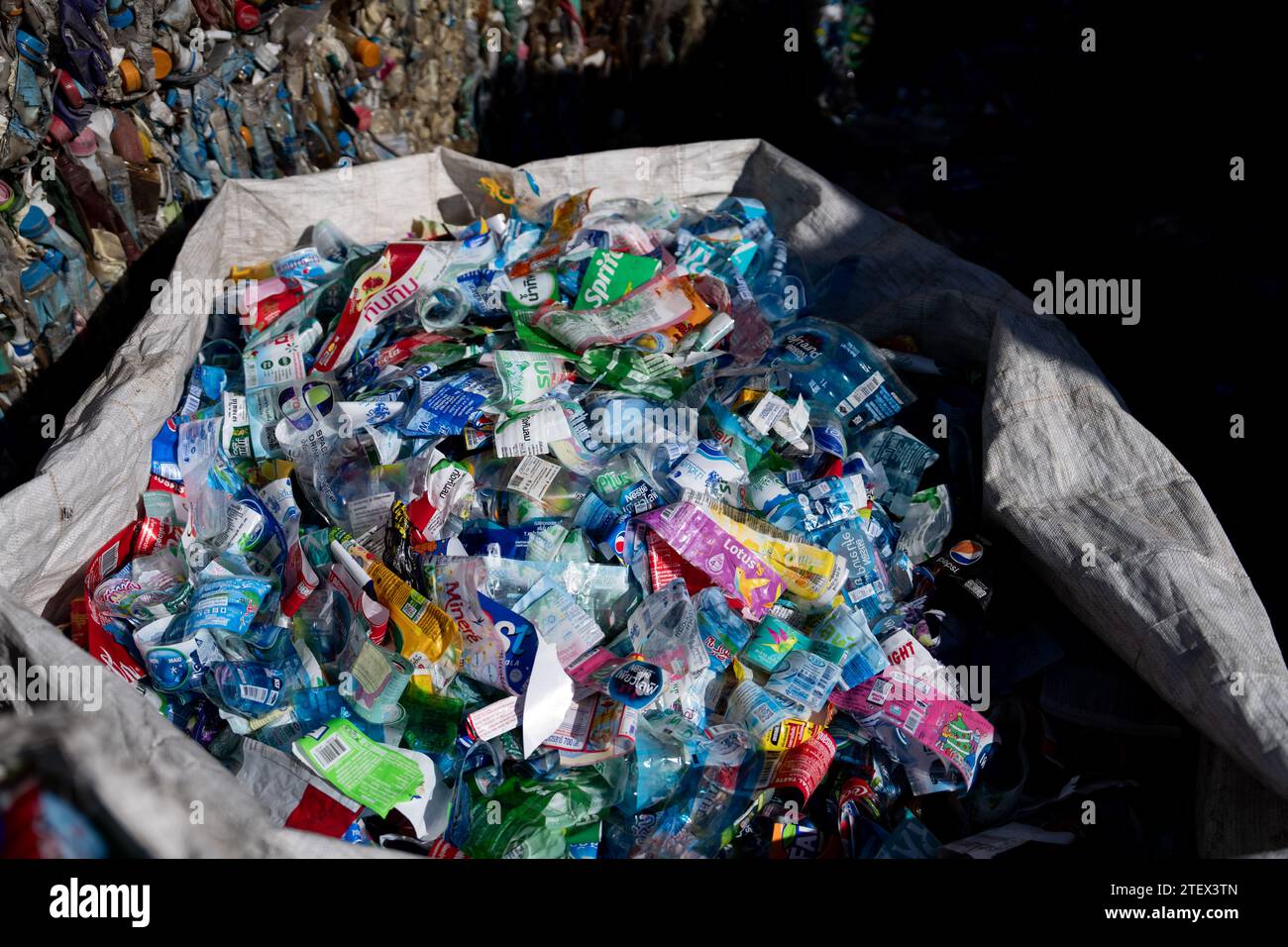 A bag of labels taken off of plastic bottles at a sorting and ...