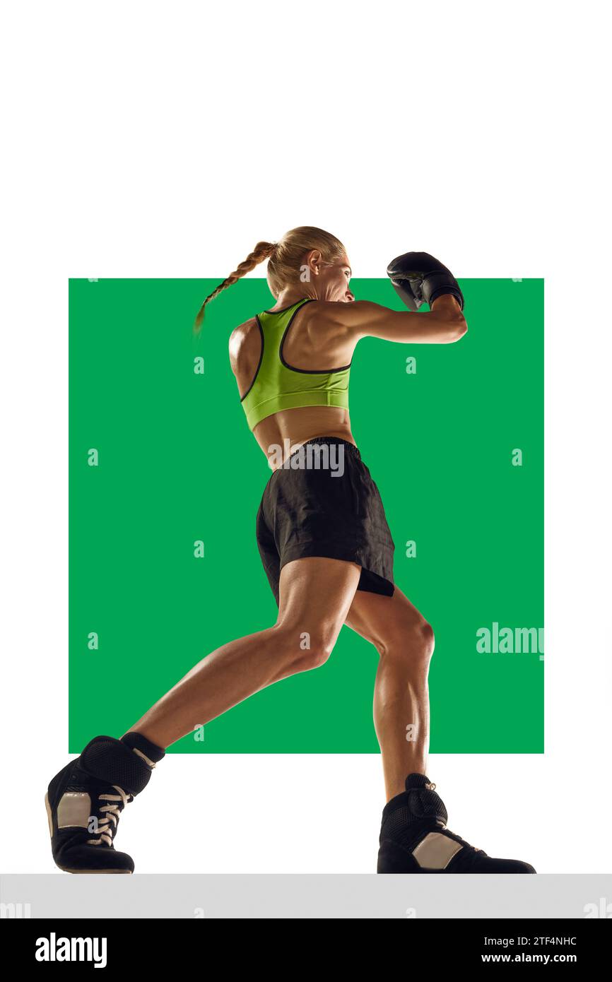 Young muscular woman with fit strong body, boxing athlete in motion ...