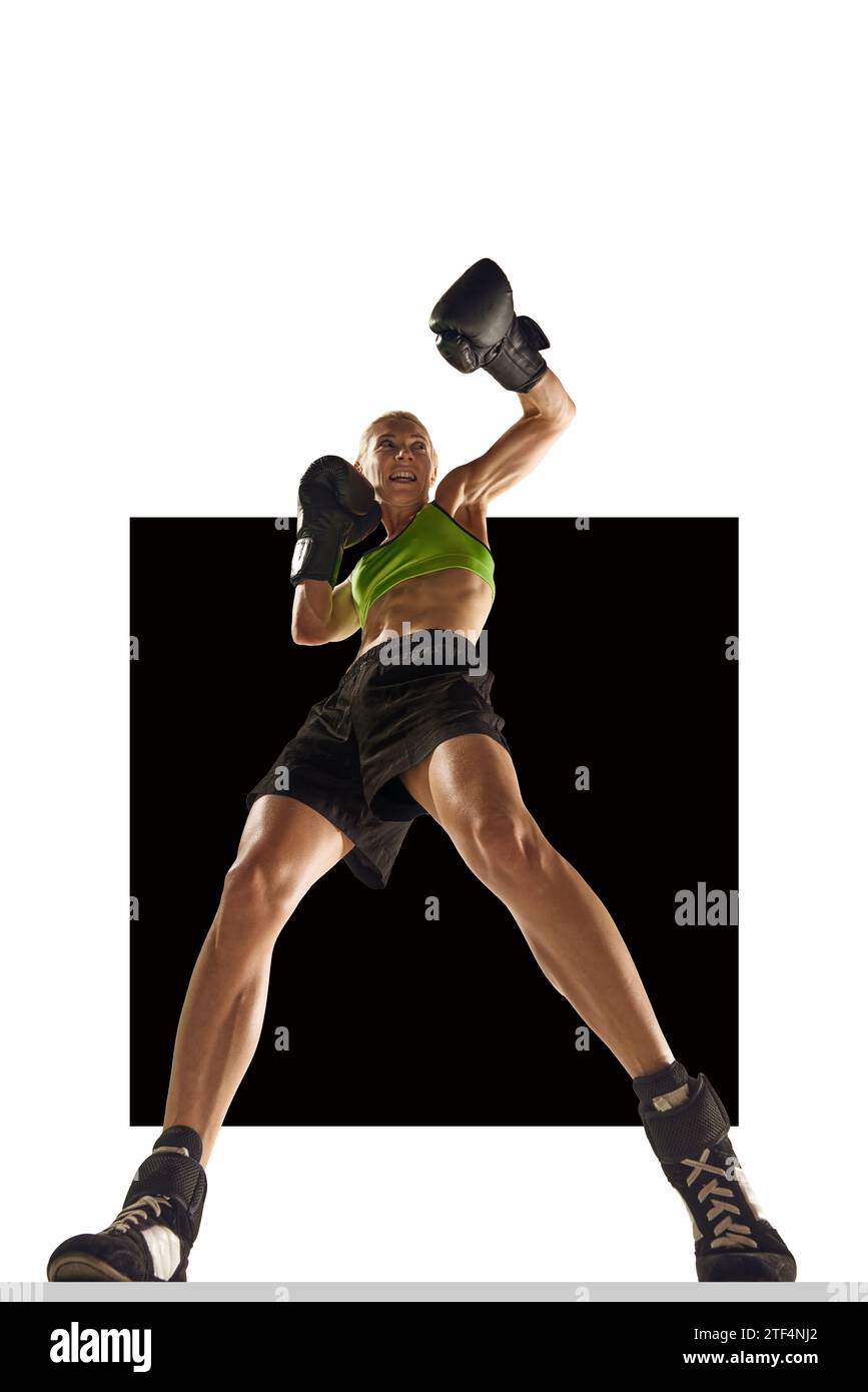 Bottom view. Sportive young woman, boxing athlete in motion, training ...