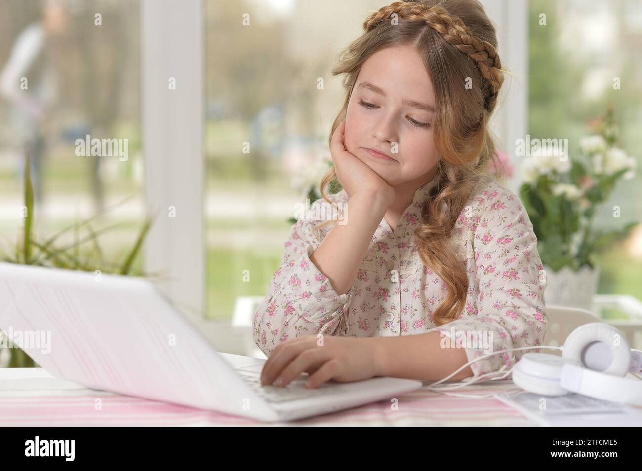 Cute and happy little girl children using laptop computer Stock Photo ...