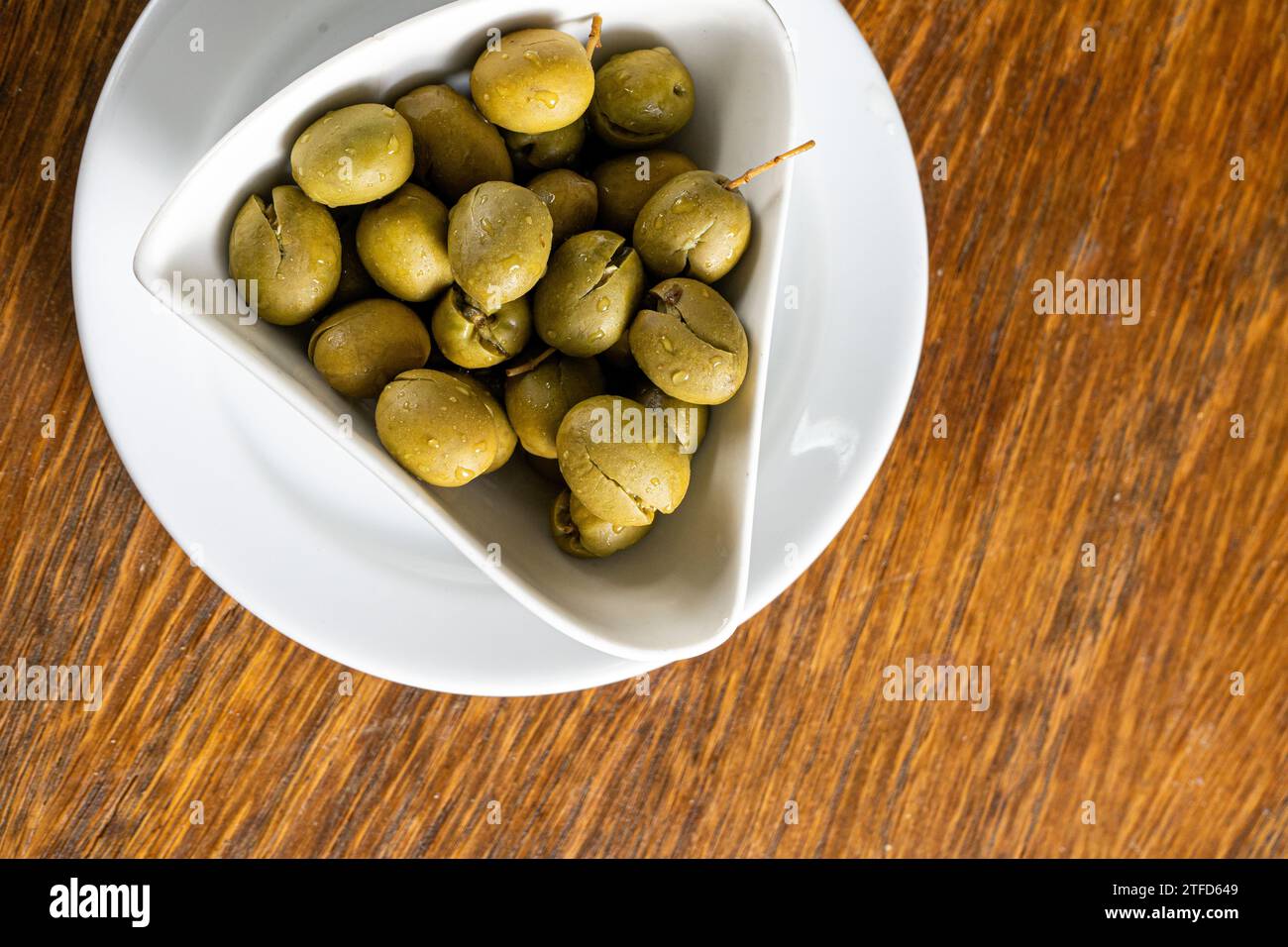 Green olives in a rustic Alentejo restaurant setting Stock Photo - Alamy
