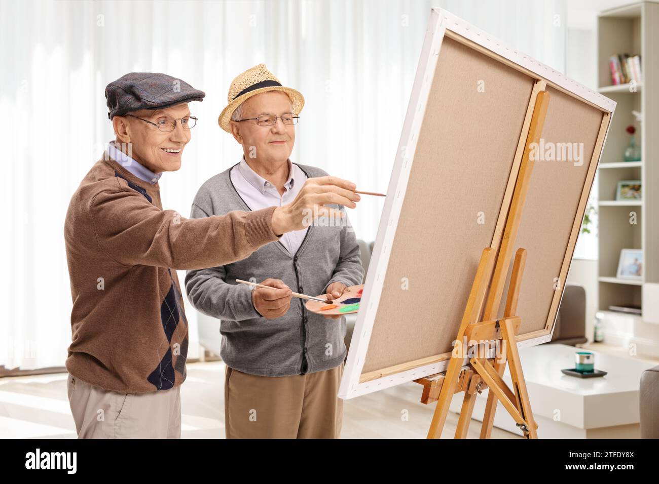 Elderly male artist painting on hi-res stock photography and images - Alamy