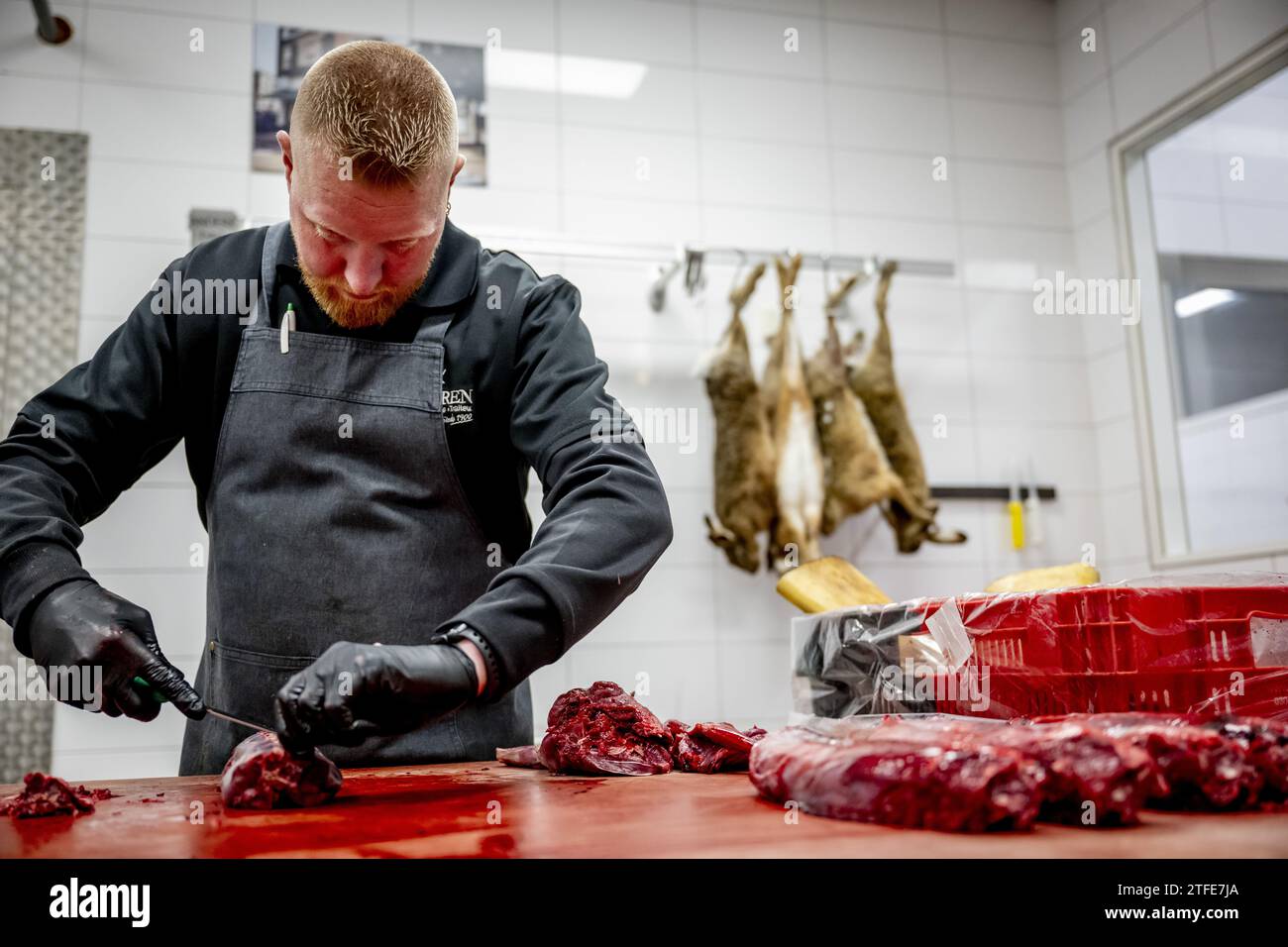 ROTTERDAM - Employees of a poulterer process orders the day before ...