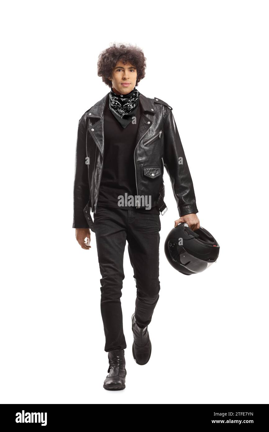 Full length portrait of a young man carrying a helmet and walking ...