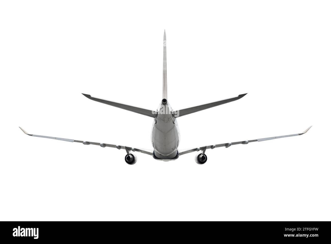Rear view of a wide body passenger aircraft flies isolated on white ...
