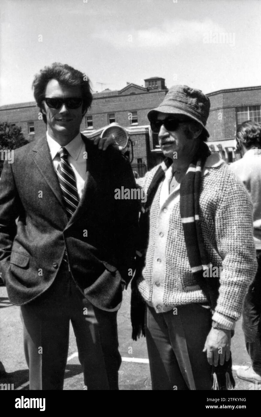 CLINT EASTWOOD and Director DON SIEGEL on set location candid photo in ...