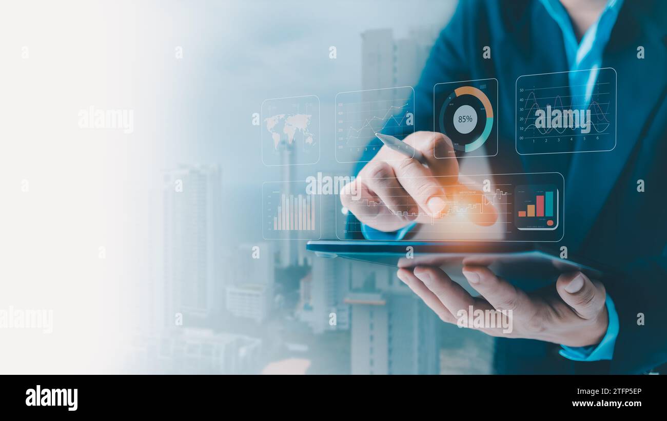 Businessman use tablets to show report graphs on the virtual screen, Business Analytics Data ...