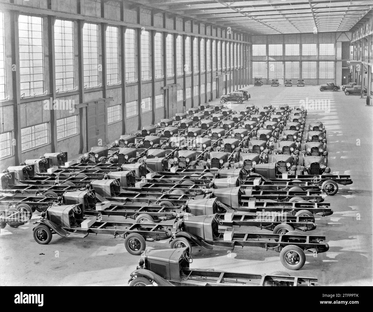 Chassis of Ford trucks set up for assembly ca. 1932 Stock Photo - Alamy