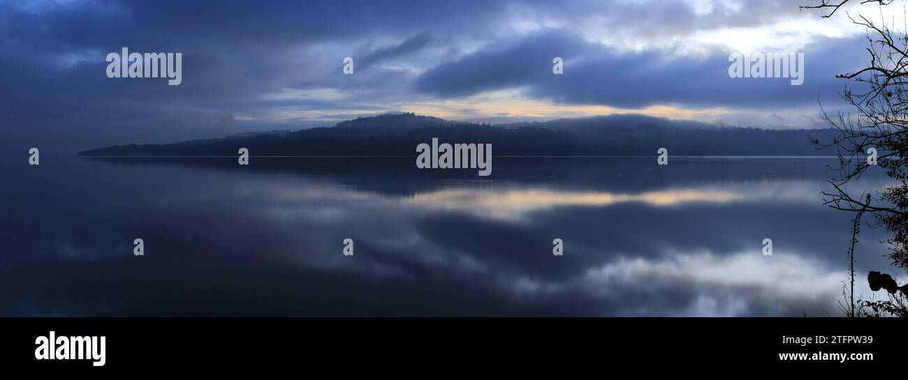 A misty dawn over Loch Lomond from Duck Bay, Balloch village, West ...
