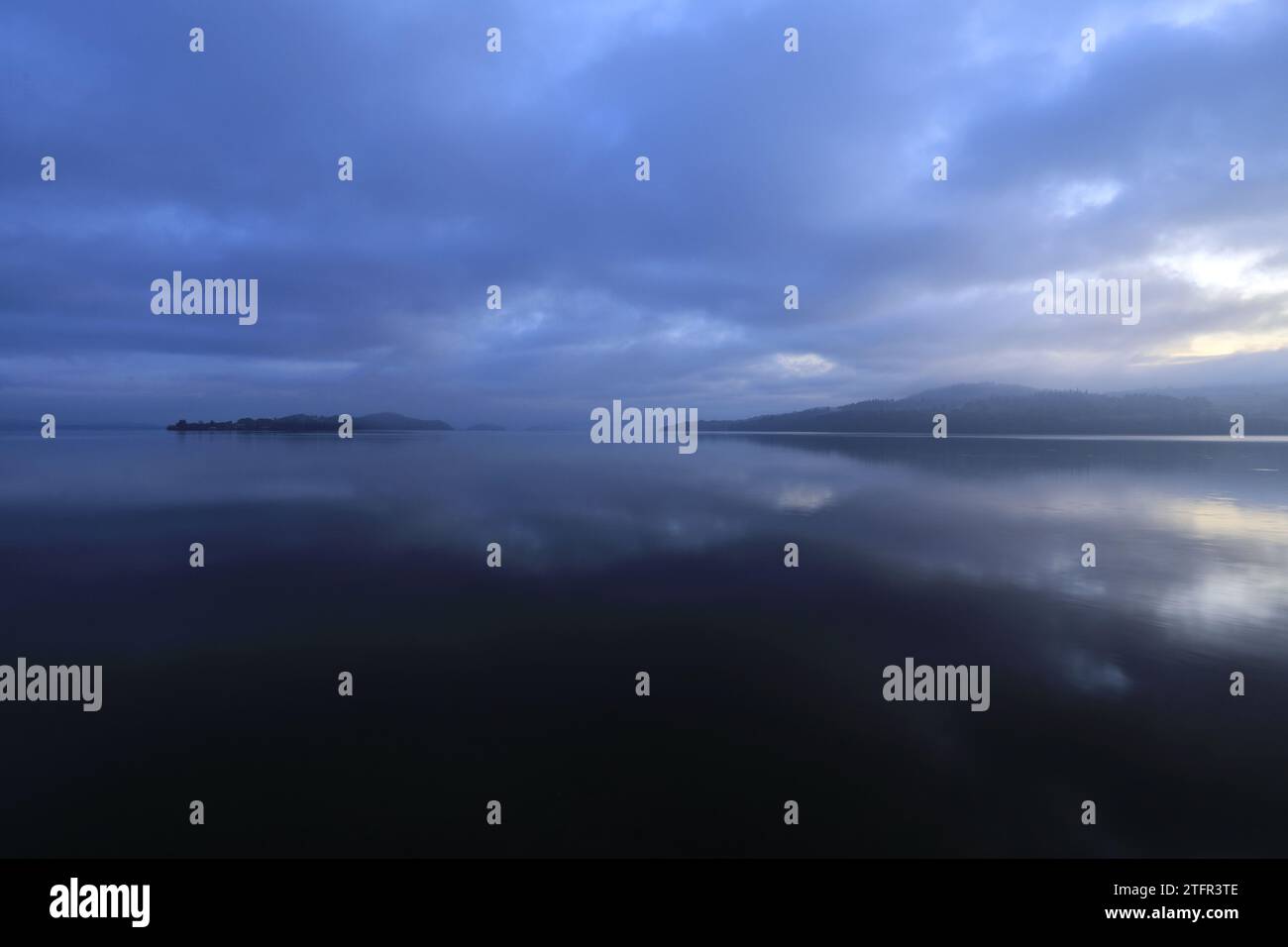 A misty dawn over Loch Lomond from Duck Bay, Balloch village, West ...