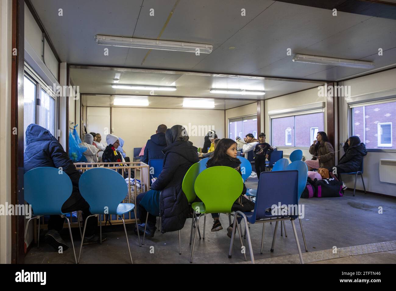 TER APEL - Asylum seekers wait in a reception area in a mobile ...