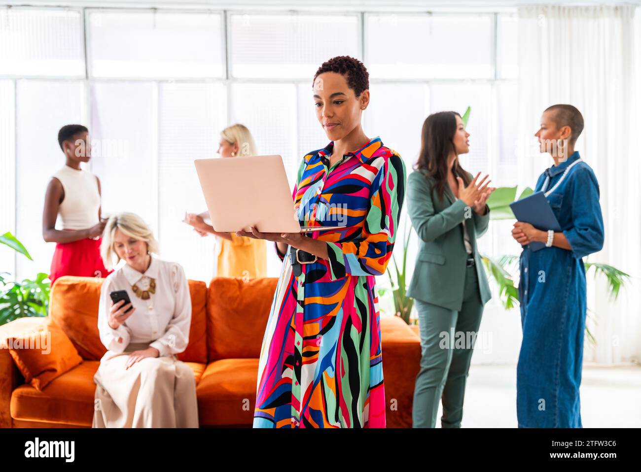 Group of beautiful confident businesswomen meeting in the office ...