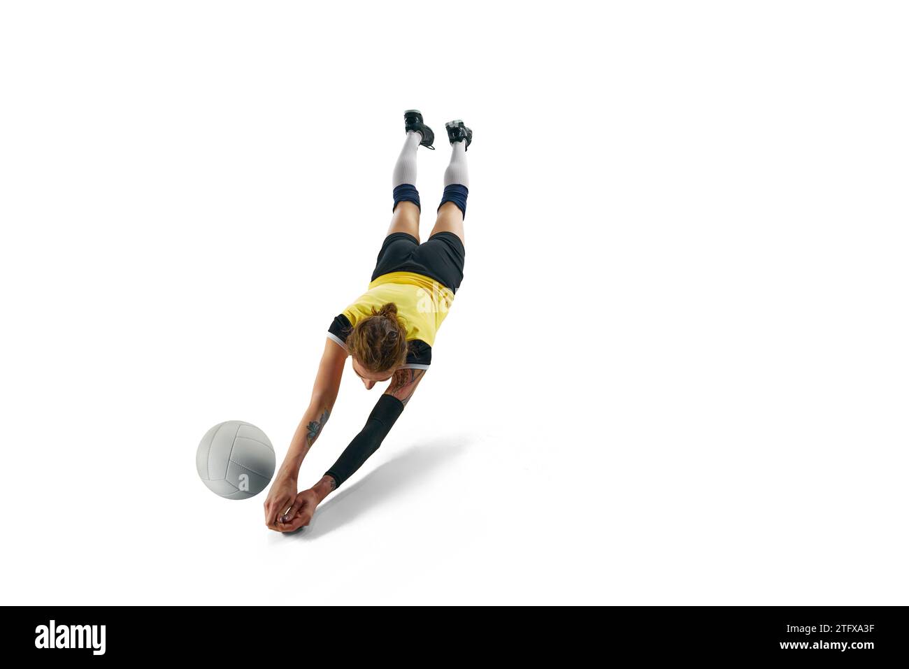 Falling down. Young woman, professional volleyball player in yellow ...