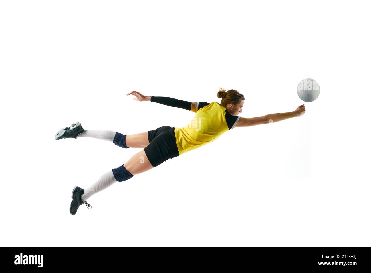 Dynamic image of young woman, volleyball player in motion, practicing ...