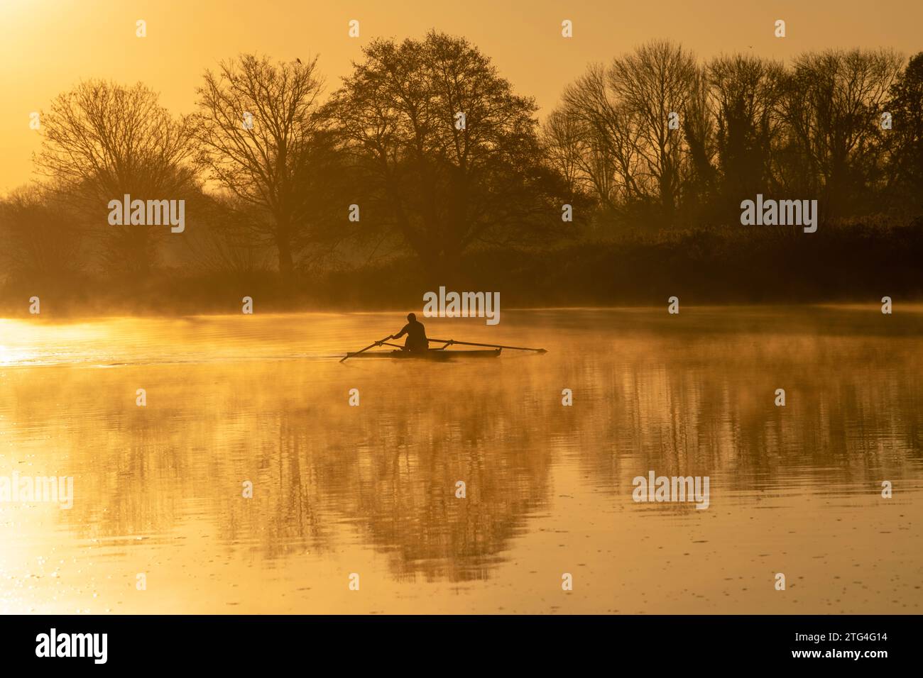 Rower on the River Trent at sunrise, on a frosty morning at Colwick ...
