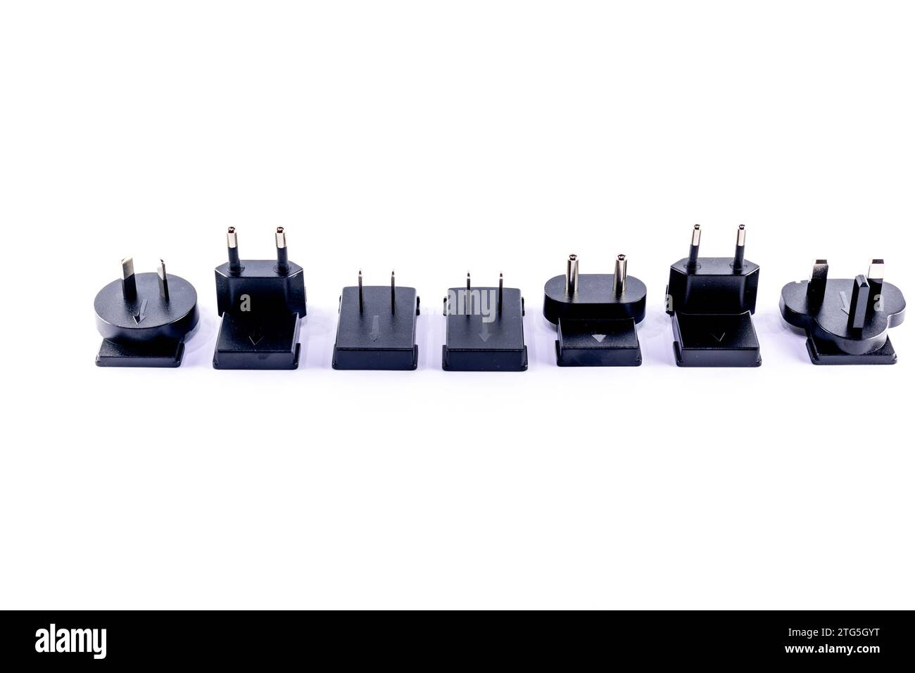 European, Chinese, American electrical socket plug on white table Stock ...