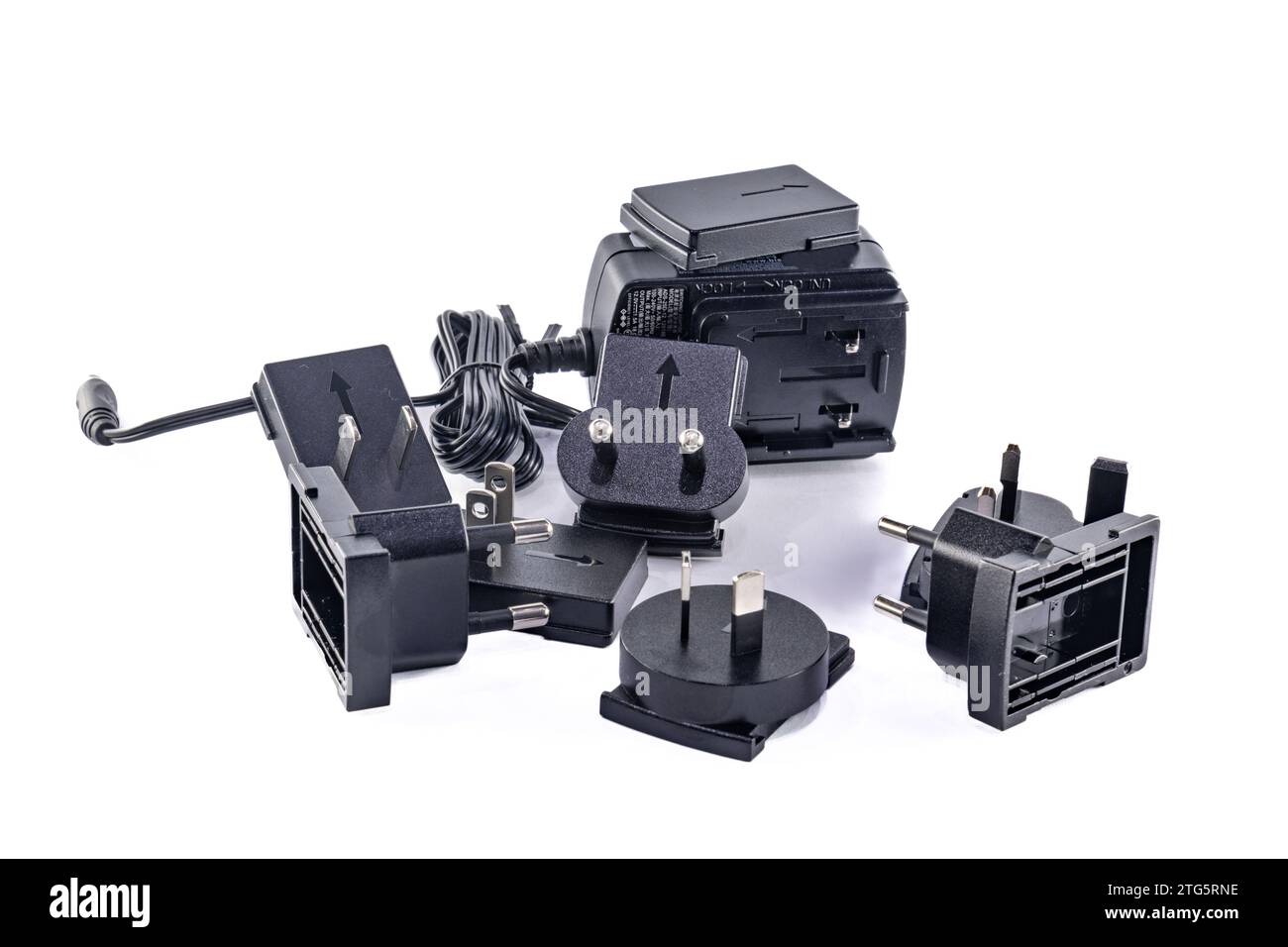 European, Chinese, American electrical socket plug on white table Stock ...