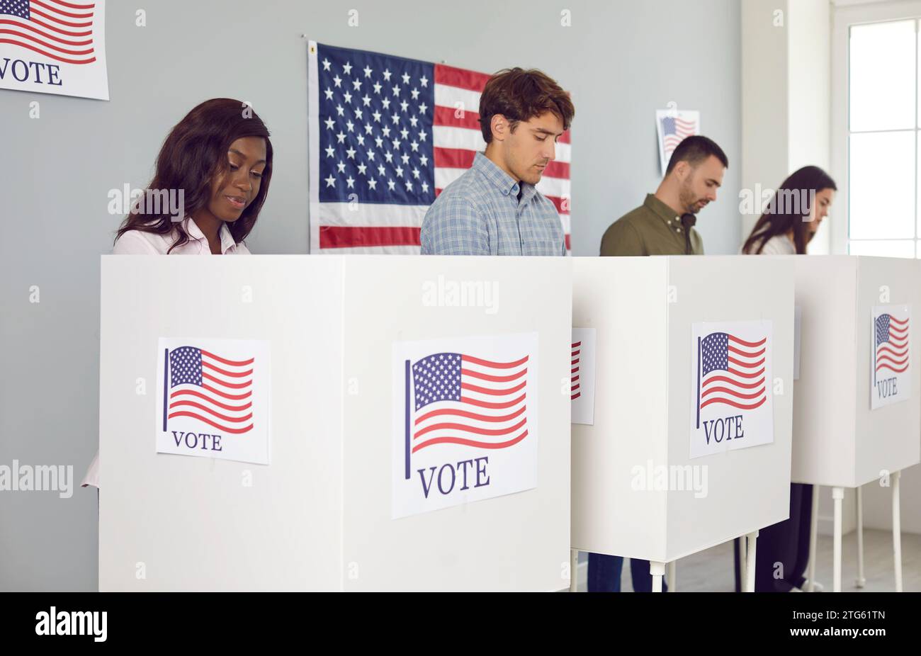 American citizens standing at vote center in voting booth putting ...