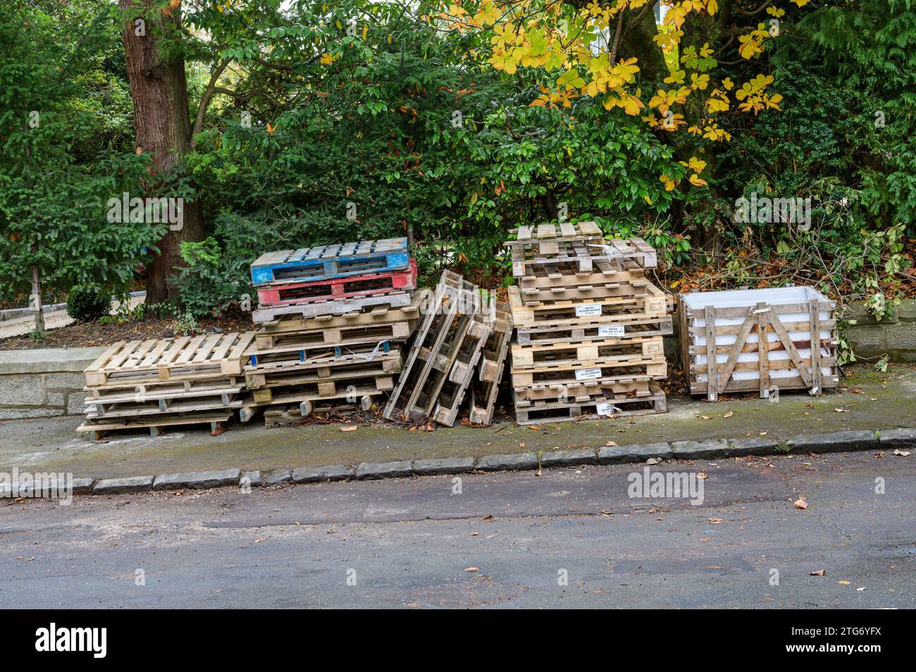 Empty wooden pallets waiting to be collected on a pavement, Scotland ...