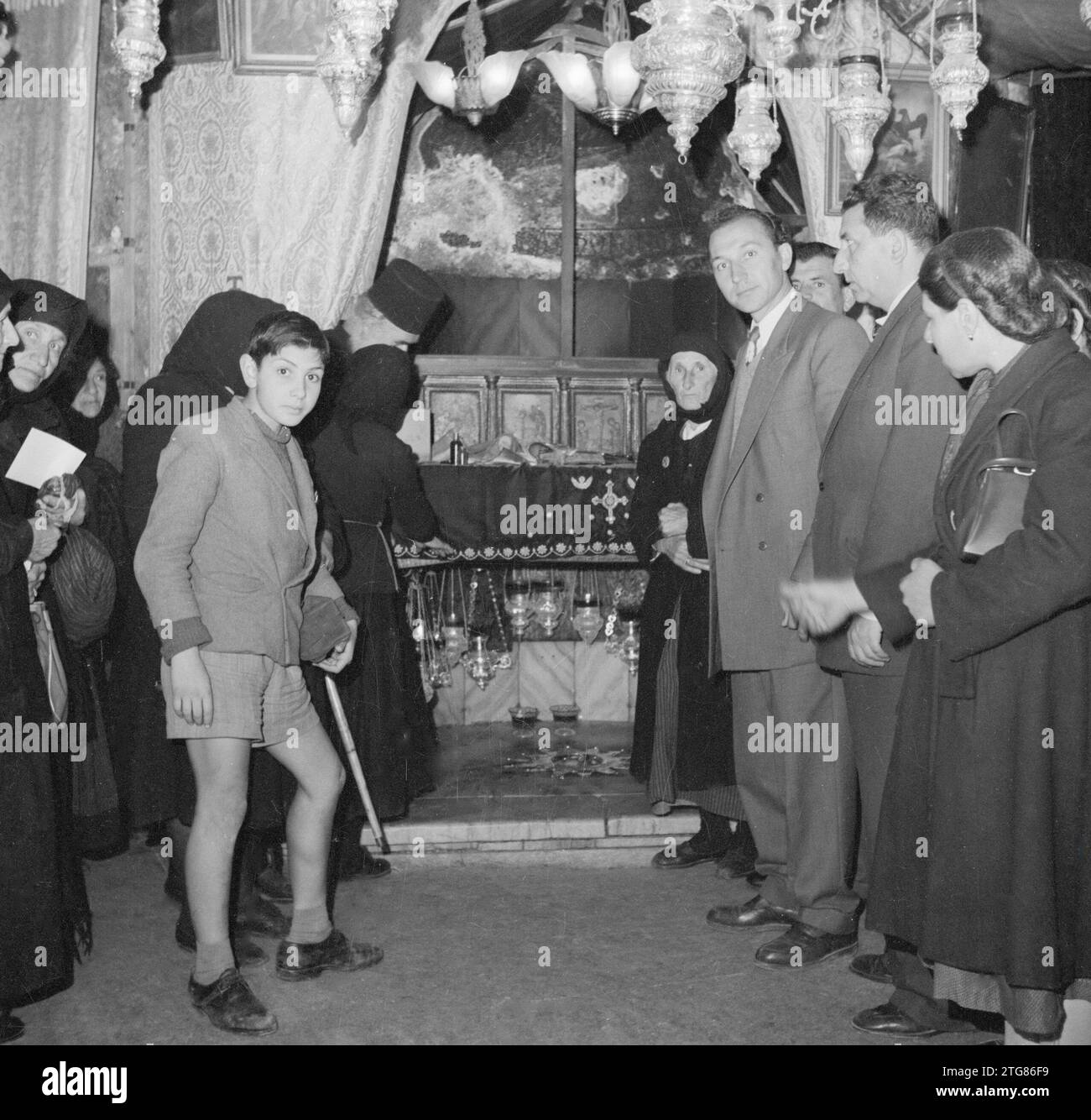 Pilgrims at the place of Jesus' birth in the cave under the Church of ...