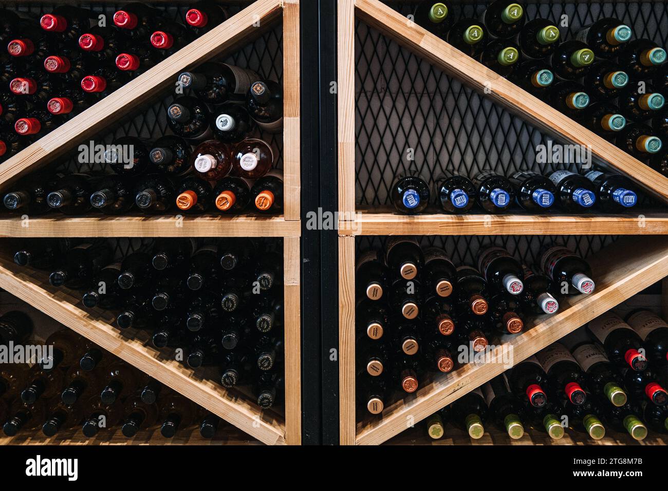 Geometric Wine Rack Filled with Assorted Bottles. Well-stocked wine ...