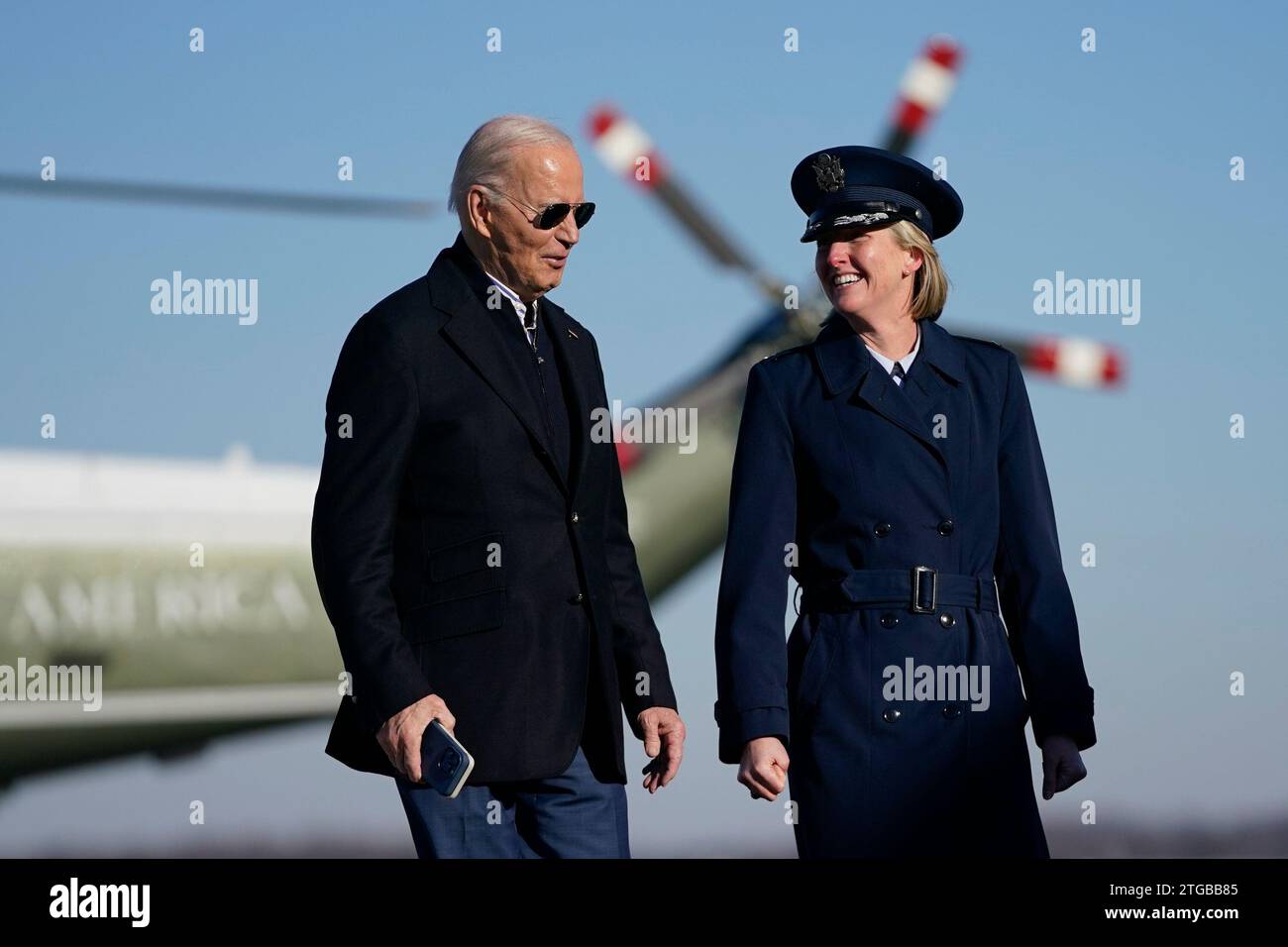 President Joe Biden, escorted by Air Force Col. Angela Ochoa, walks to ...