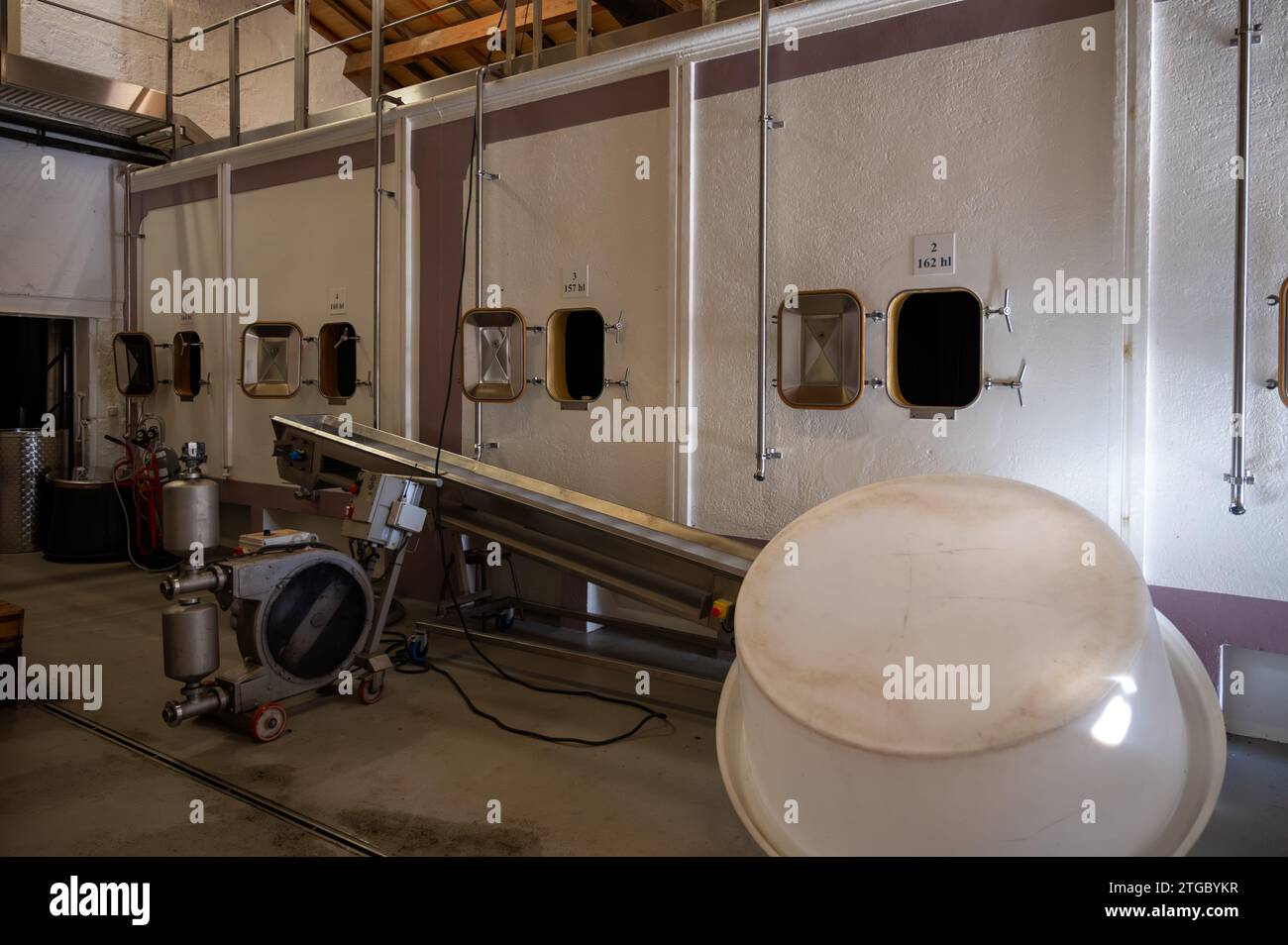 Old concrete tanks for first fermentation of grapes on Bordeaux winery ...