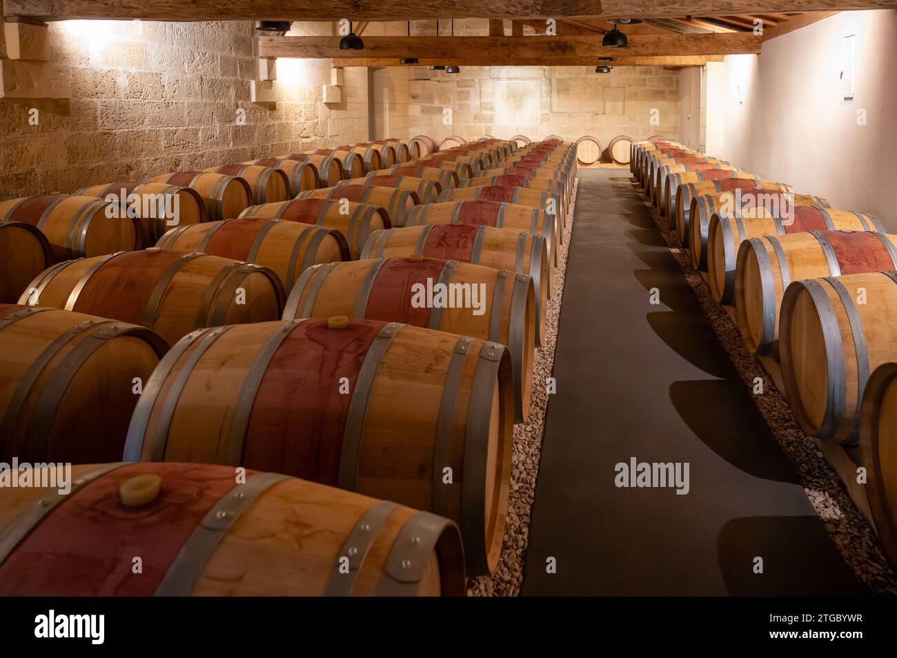 French oak wooden barrels for aging red wine in cellar, Saint-Emilion ...
