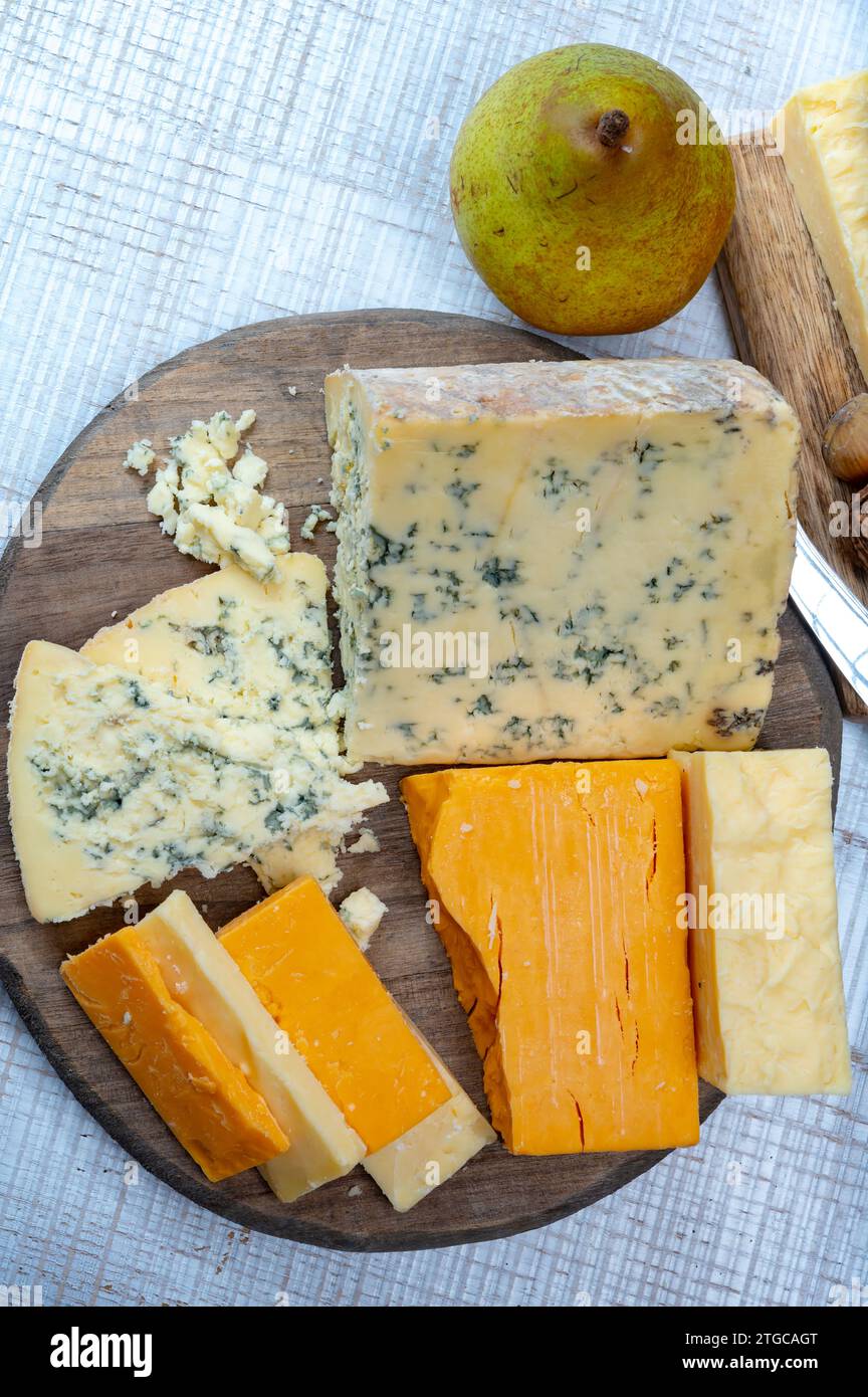 English cheeses collection, mature and coloured cheddar cheese and semi ...