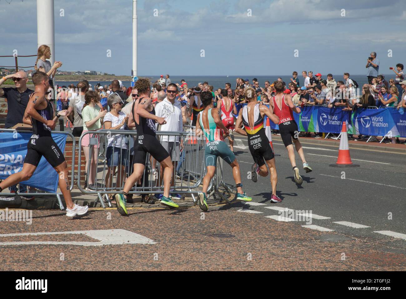 Crowds watch the elite athletes in the World Triathlon Championship ...