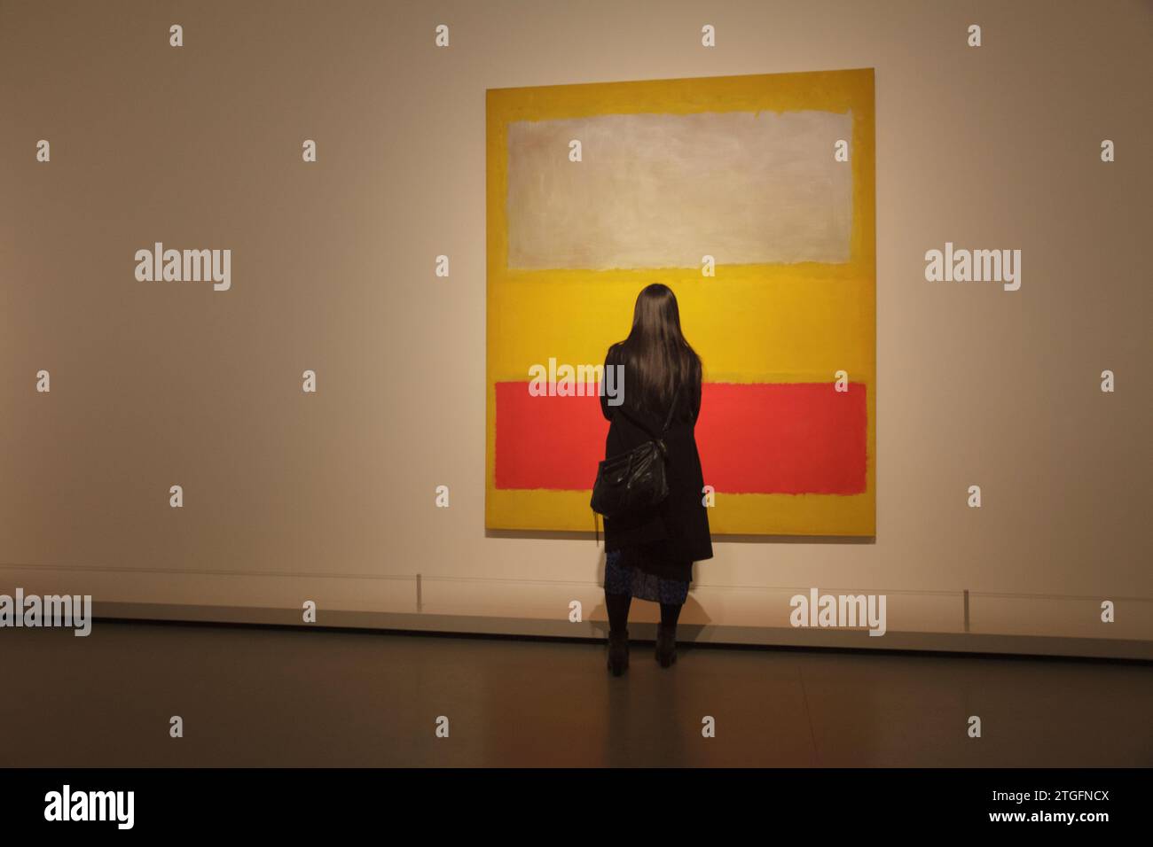 A woman views a picture at the retrospective exhibition by artist Mark ...