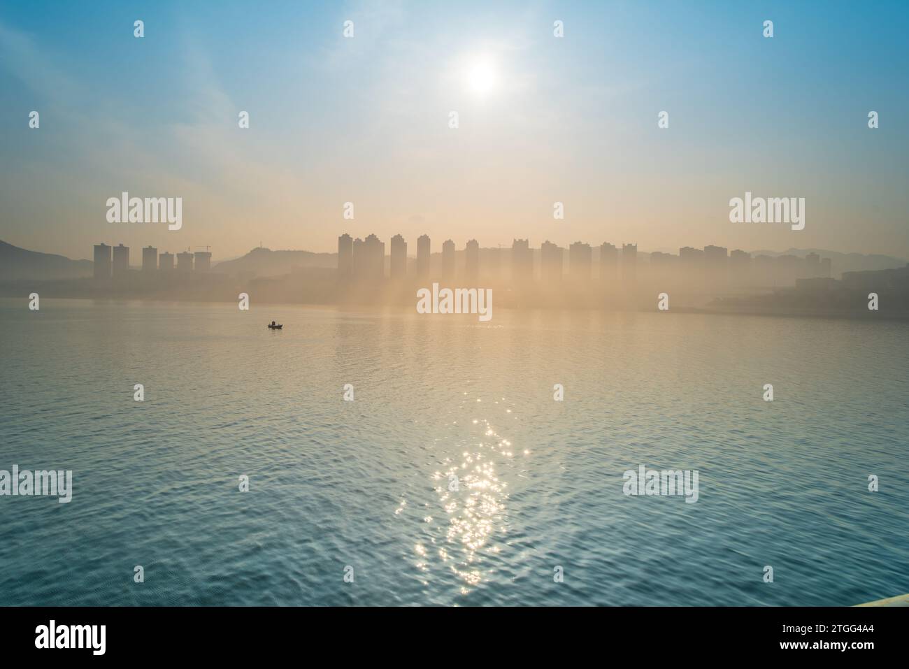 A quiet view of a bridge in Chongqing shrouded in mist captures the ...
