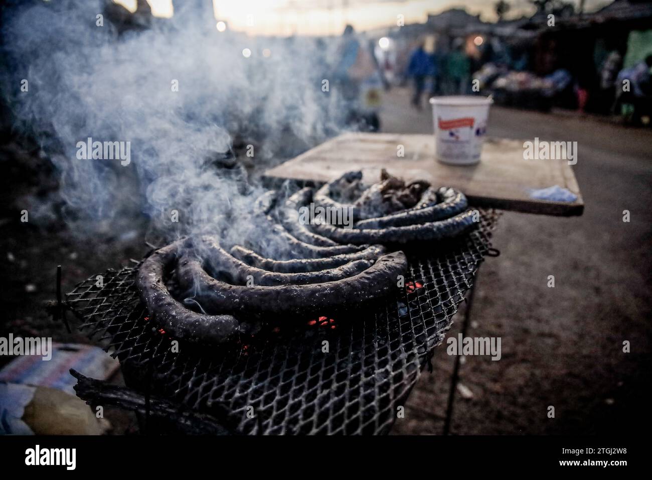 NAIROBI, Africa. 19th Dec, 2023. A man selling street food in Kibera ...