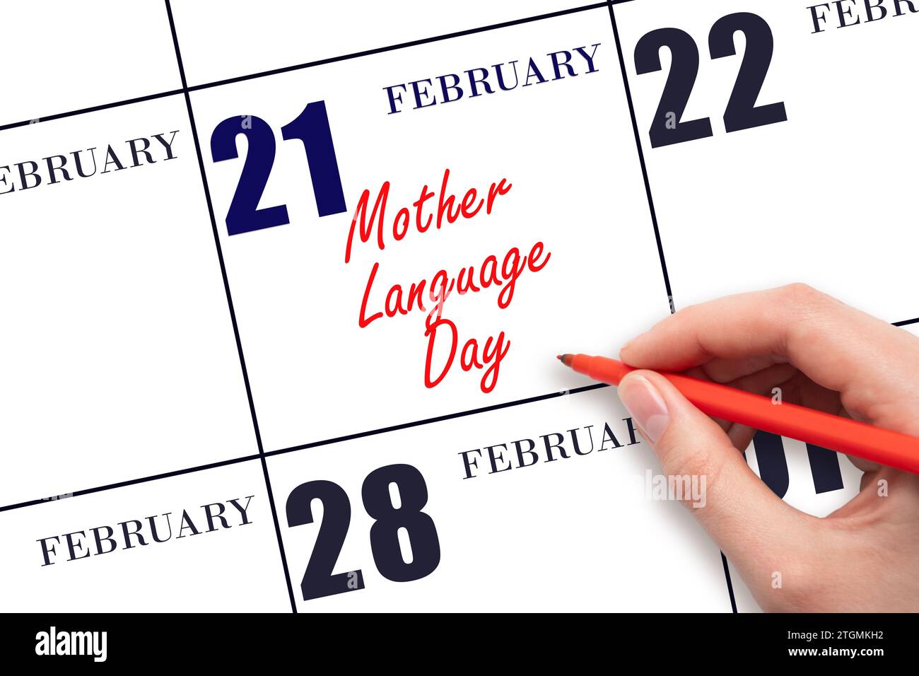 February 21. Hand writing text Mother Language Day on calendar date ...