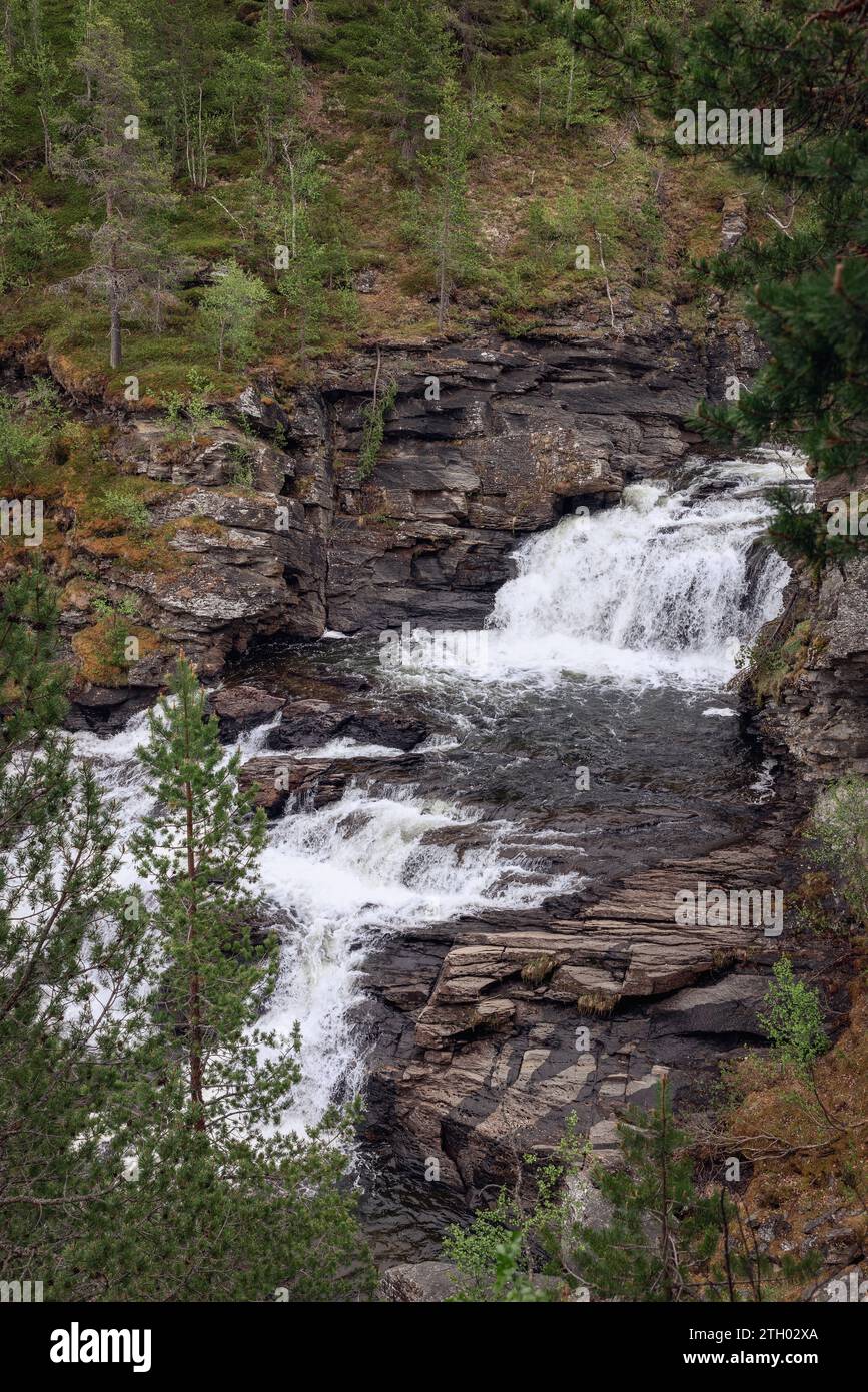 Vertical photograph showcasing the cascades of the Orkla River as it ...