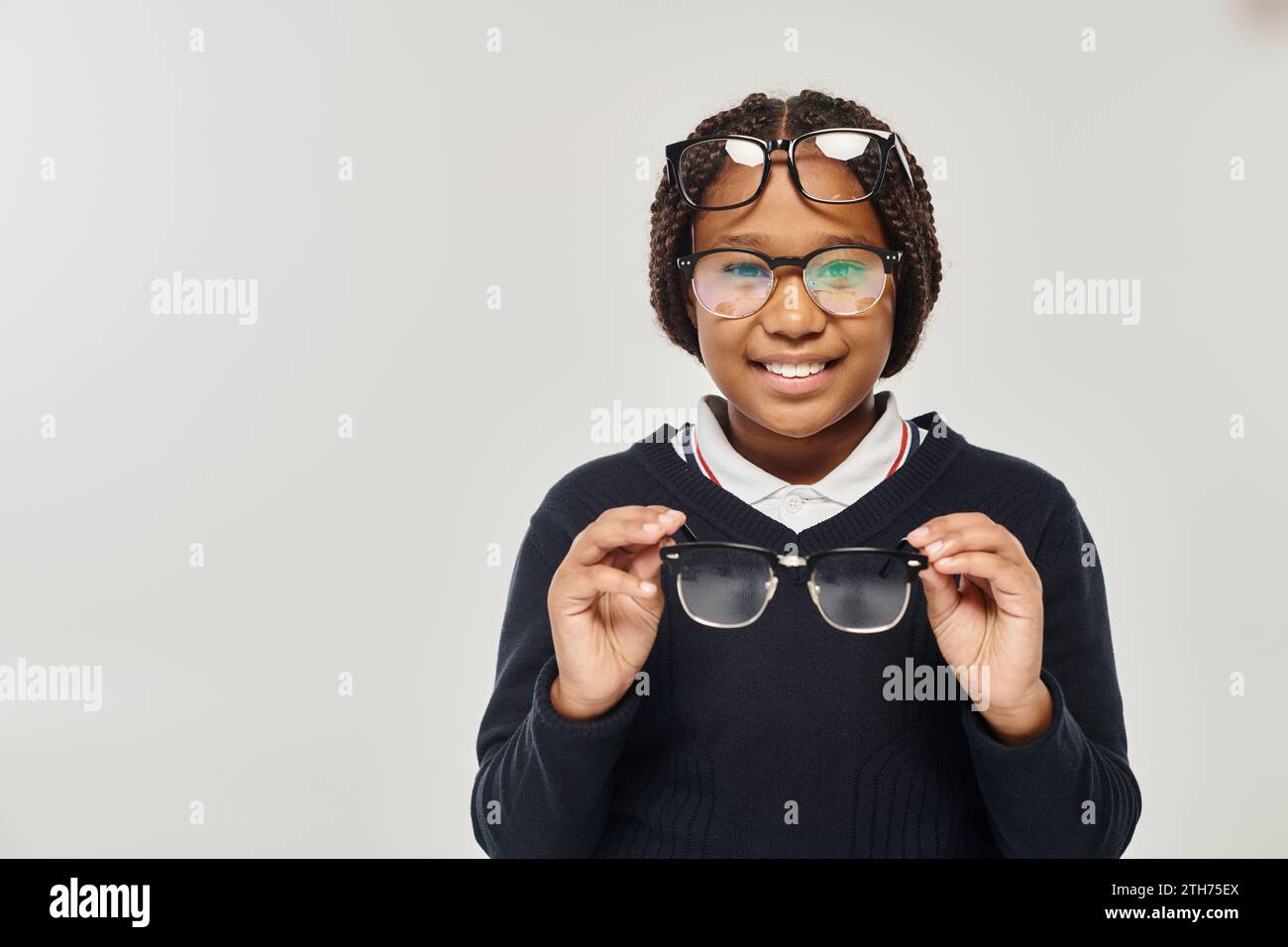 Child girl portrait african glasses hi-res stock photography and images ...
