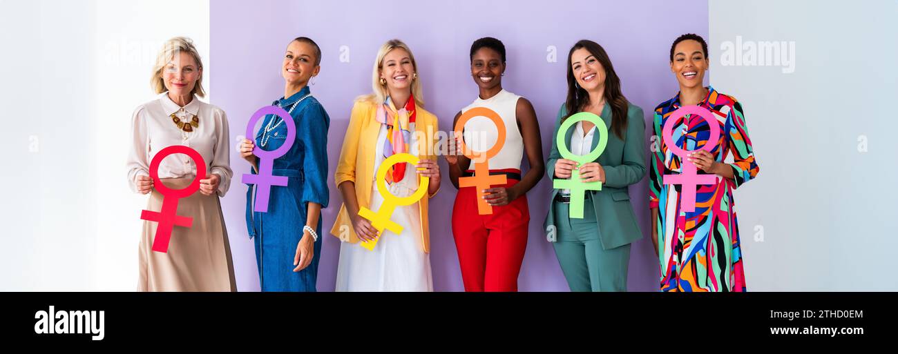 Group of beautiful confident women holding the femininity Venus symbol ...