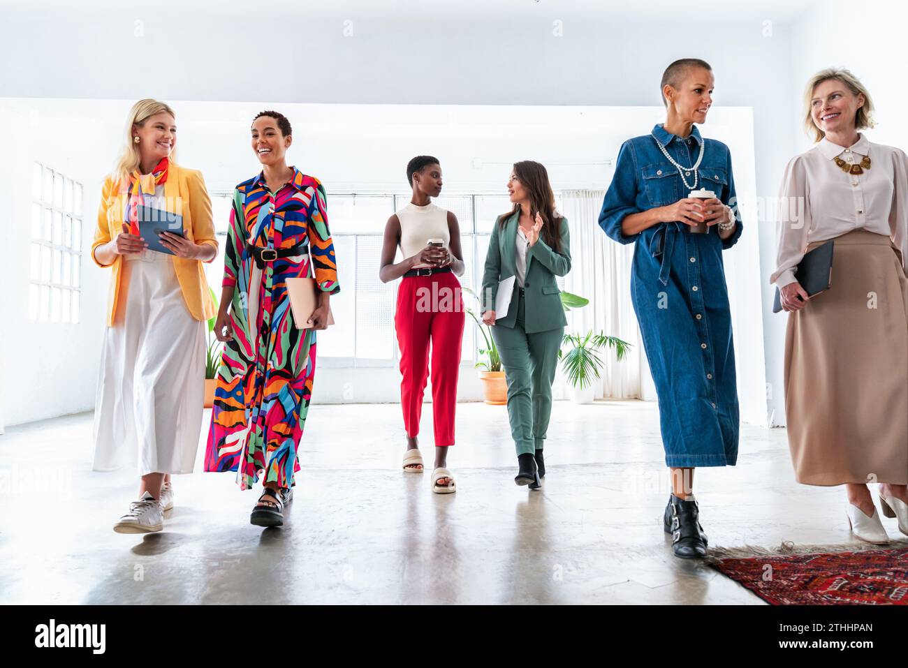 Group of beautiful confident businesswomen meeting in the office ...