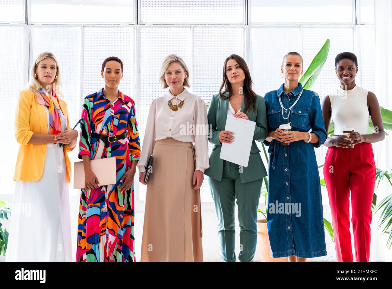 Group of beautiful confident businesswomen meeting in the office ...