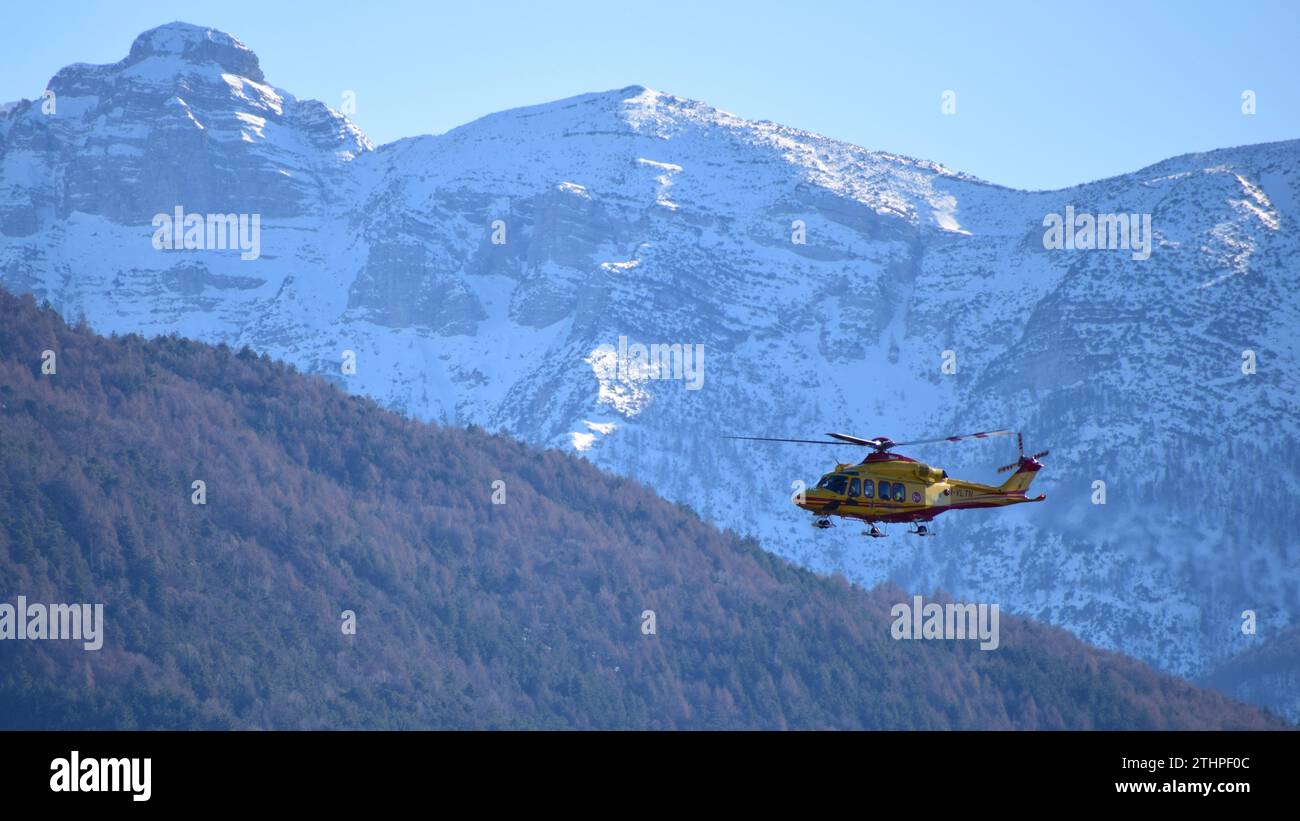 Rescue helicopter in action in the Italian Alps, global warming ...