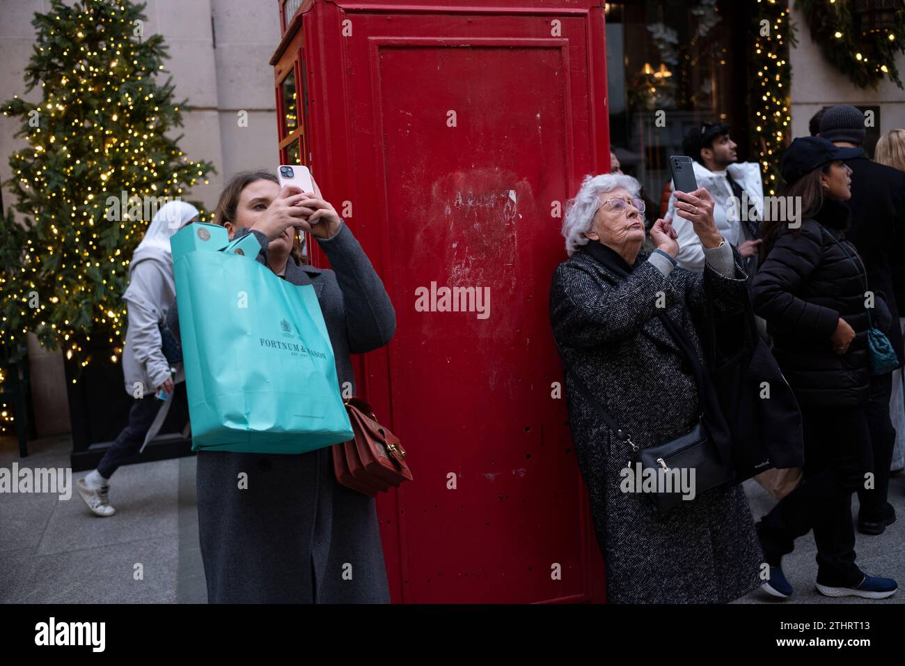 Festive tourists out in force taking selfies and pics of Xmas displays ...