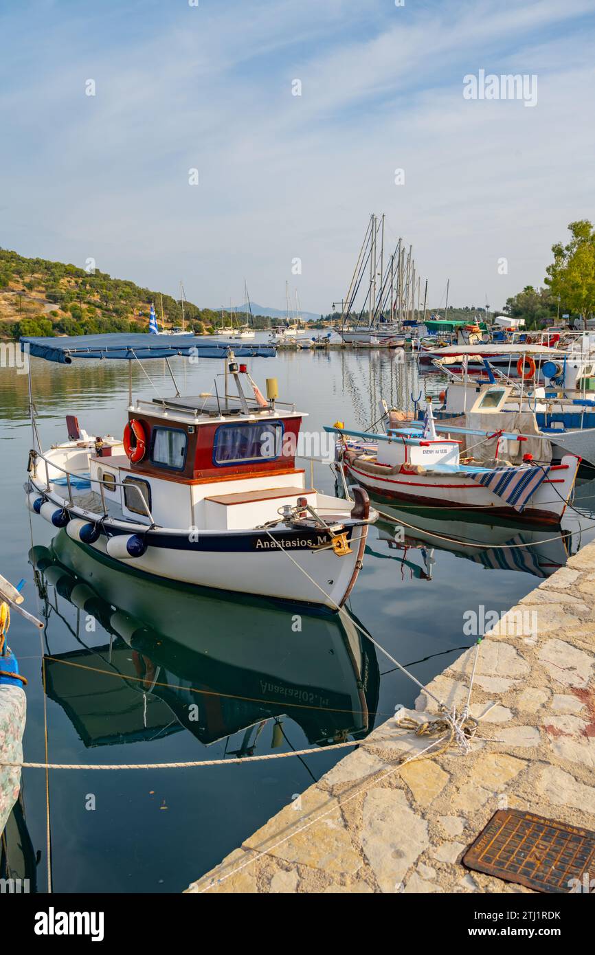 Fishing boats moored in the harbour of Vathi on the island of Meganisi ...