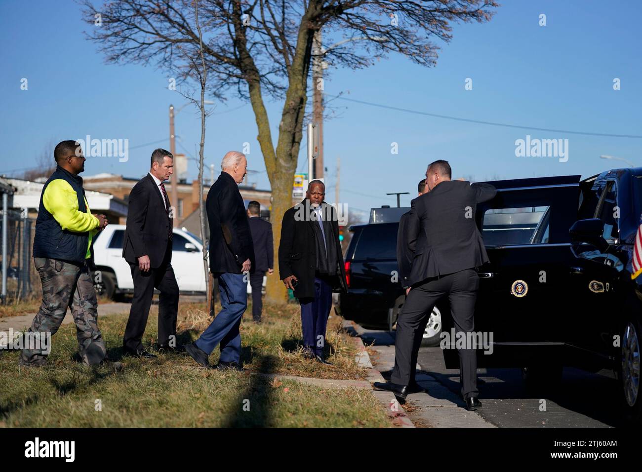President Joe Biden walks to his motorcade with Rashawn Spivey, CEO of ...