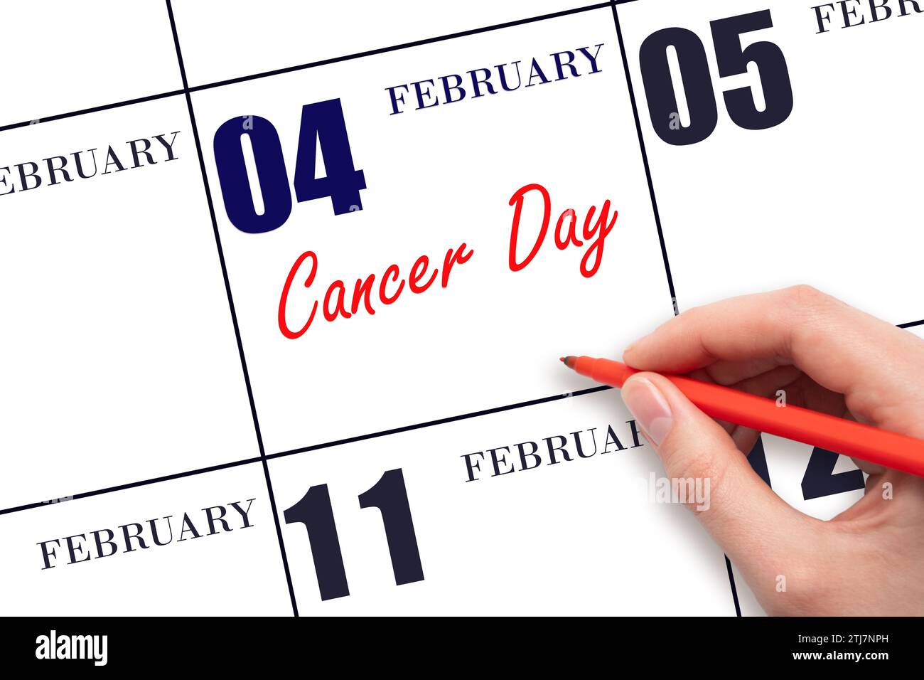February 4. Hand writing text Cancer Day on calendar date. Save the ...